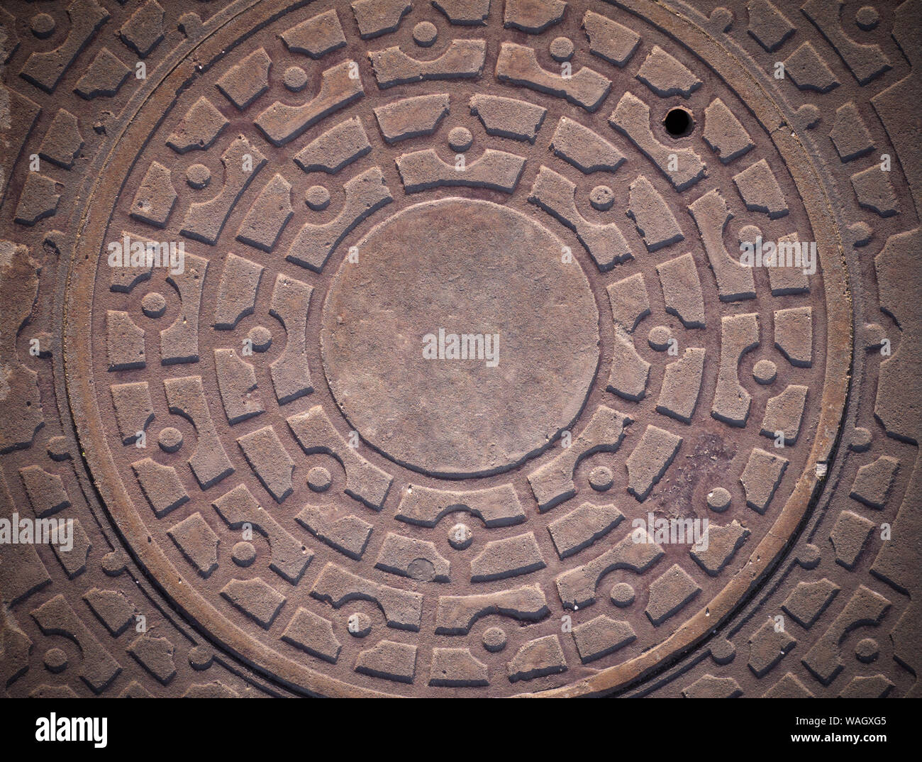 sewer metal iron hatch on the sidewalk with vignette. background ...