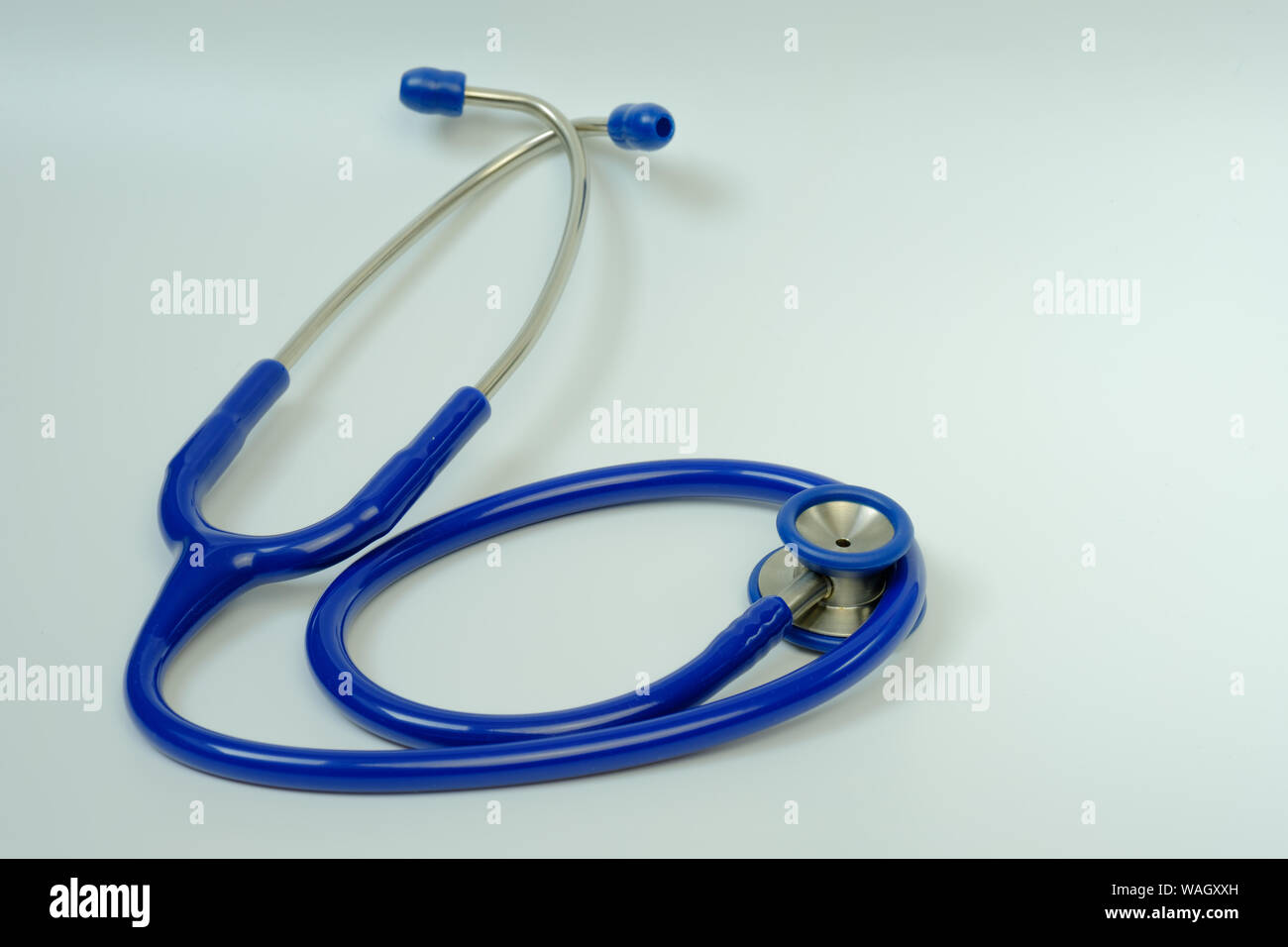 In this photo you can see a blue stethoscope for children. This photo ...