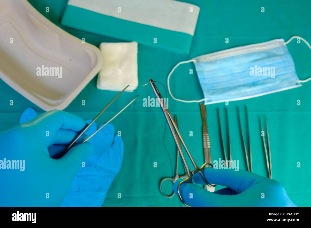 In this photo you can see a set of surgical material on a sterile green ...