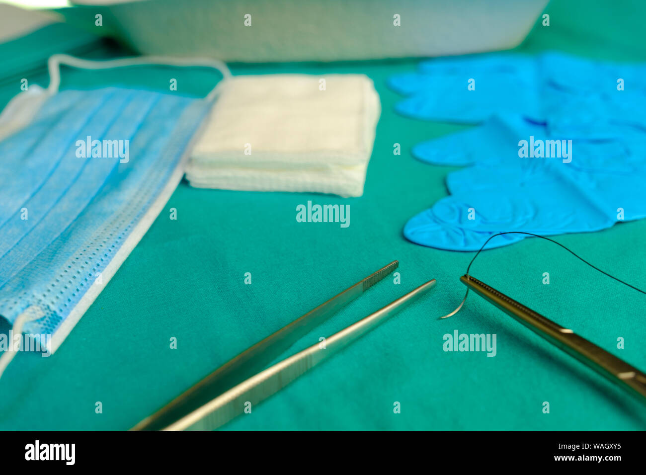 In this photo you can see a set of surgical material on a sterile green ...
