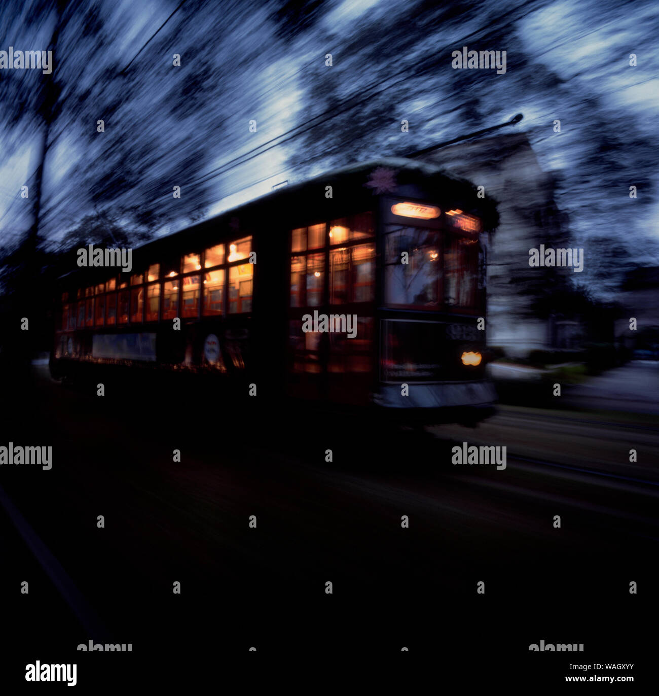 A bus is zooming past a road Stock Photo - Alamy