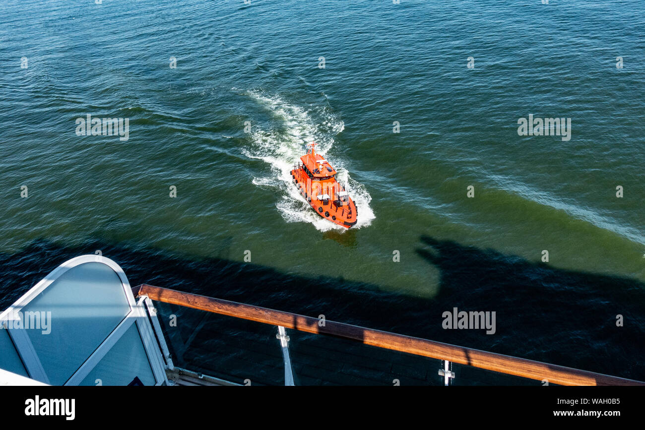Pilot ship approaches cruise ship Stock Photo - Alamy