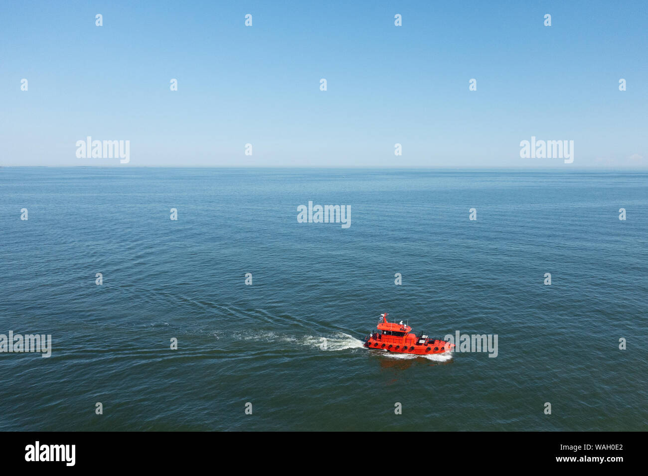 Pilot ship approaches cruise ship Stock Photo - Alamy
