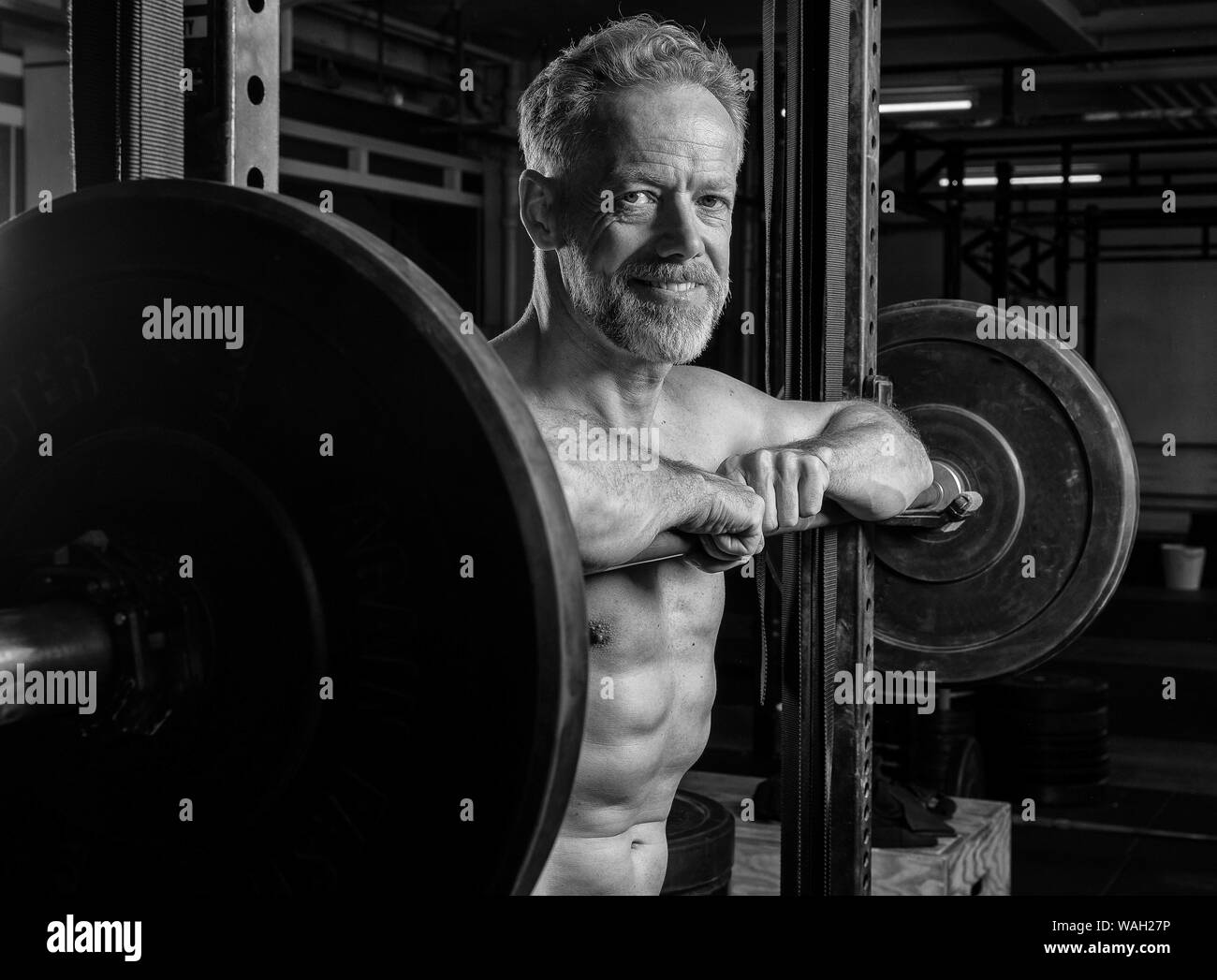 Black and white portrait of an attractive older male athlete with ...