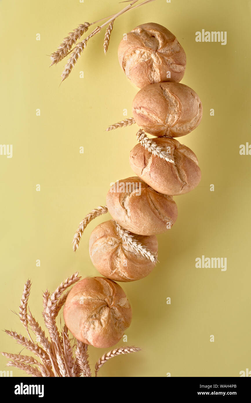 Pyramid of rusty round bread rolls, known as Kaiser or Vienna rolls ...
