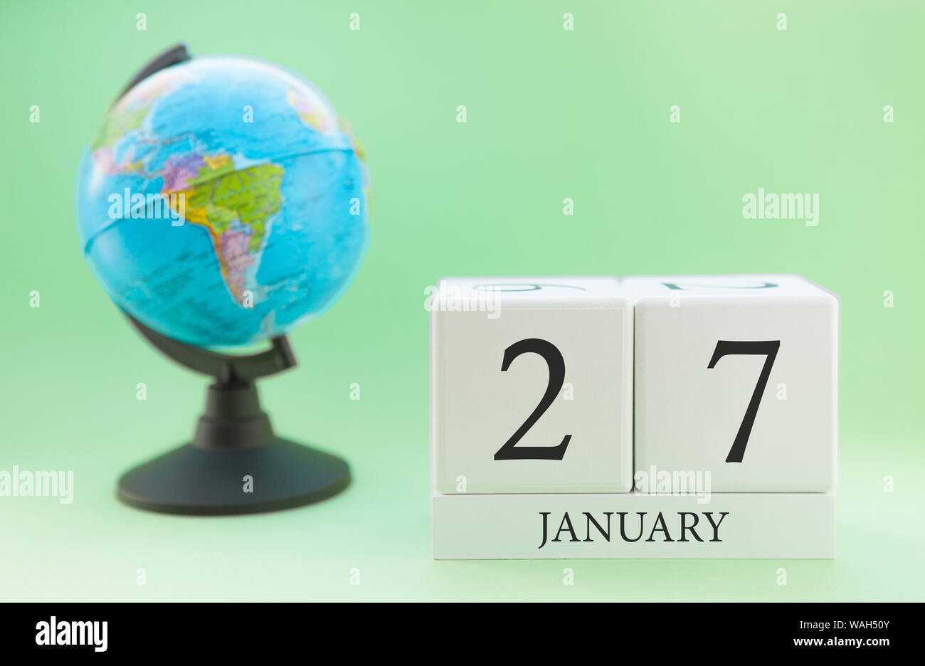 Planner wooden cube with numbers, 27 day of the month of January ...