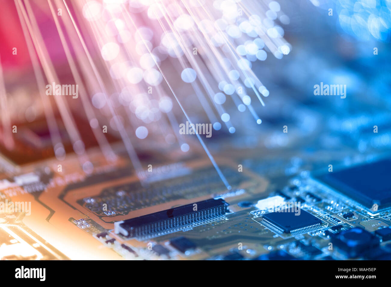 Closeup on electronic board and neon electric lights, blurred and toned ...