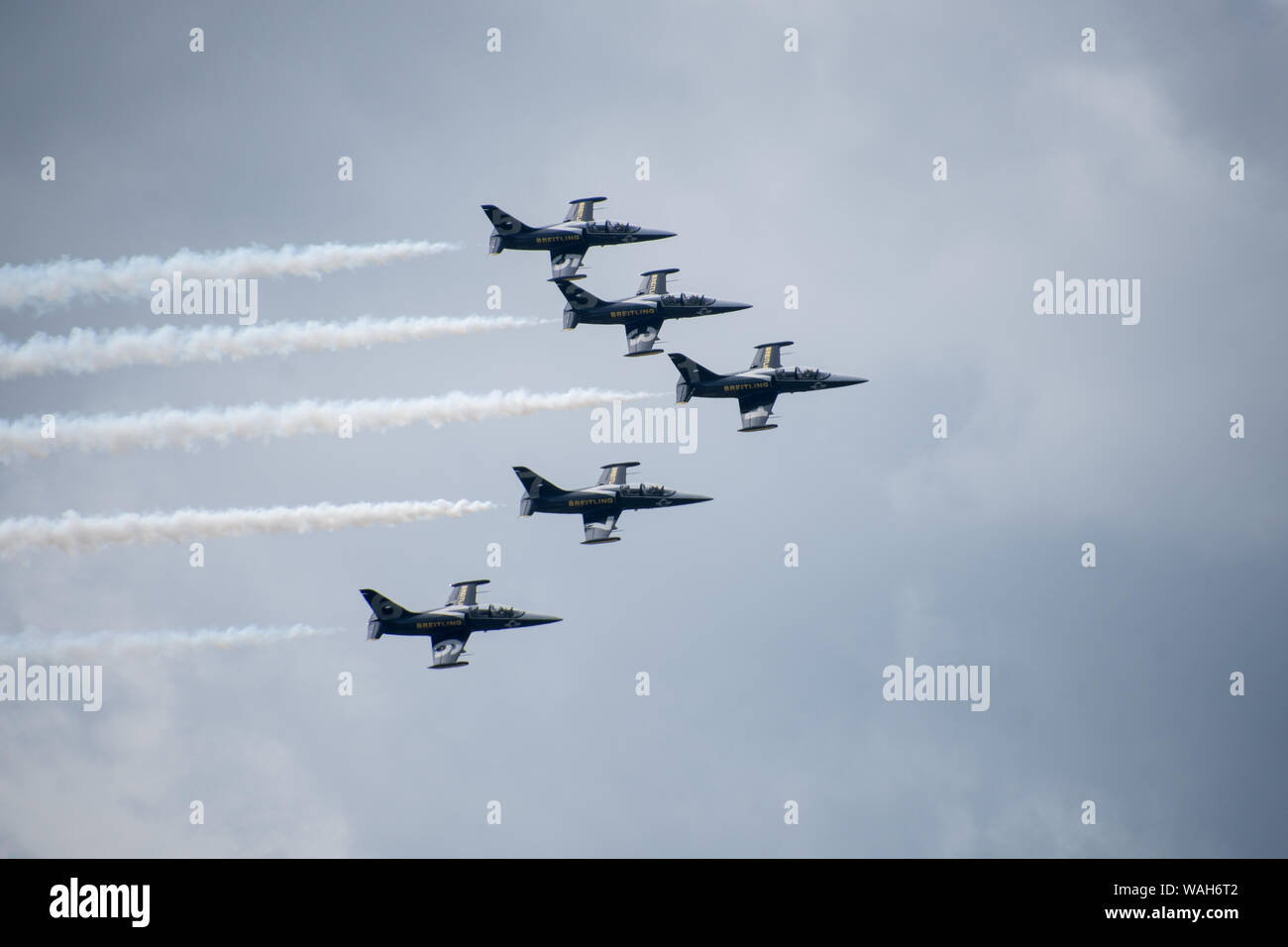 Breitling Jet Team formation flying with smoke trails Stock Photo - Alamy