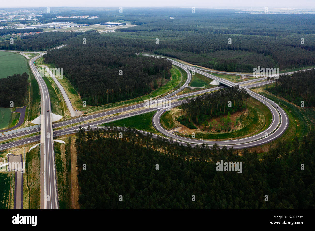 Aerial drone photography of the city suburbs, highway around the main ...