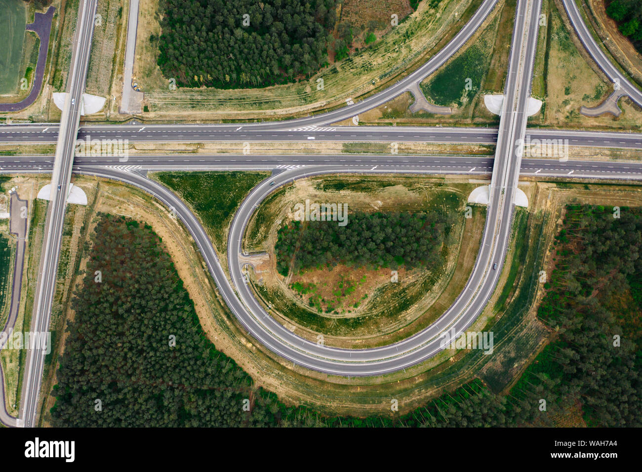 Aerial drone photography of the city suburbs, highway around the main ...