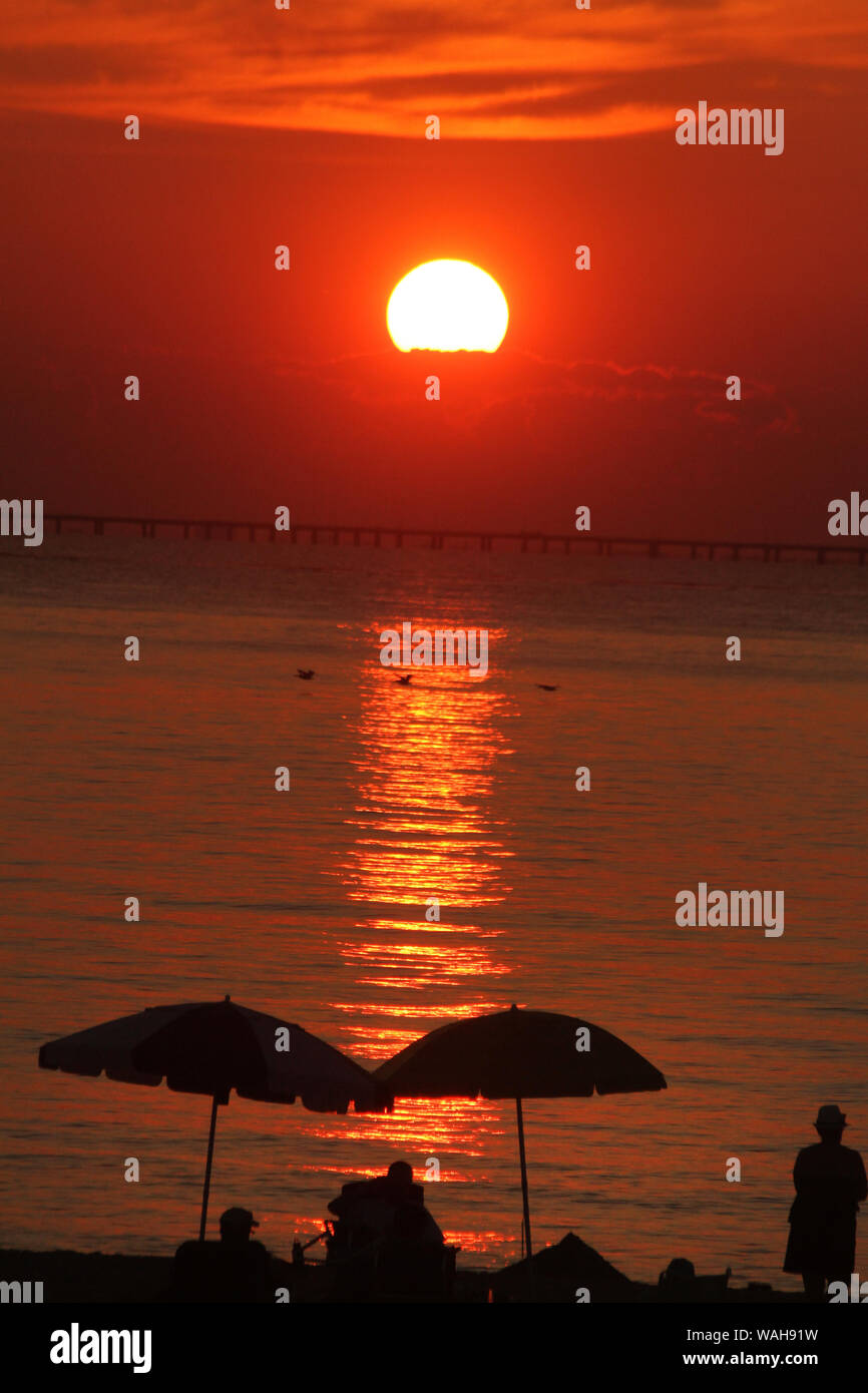 Sunset at Virginia Beach, with view of Chesapeake Bay Bridge–Tunnel ...