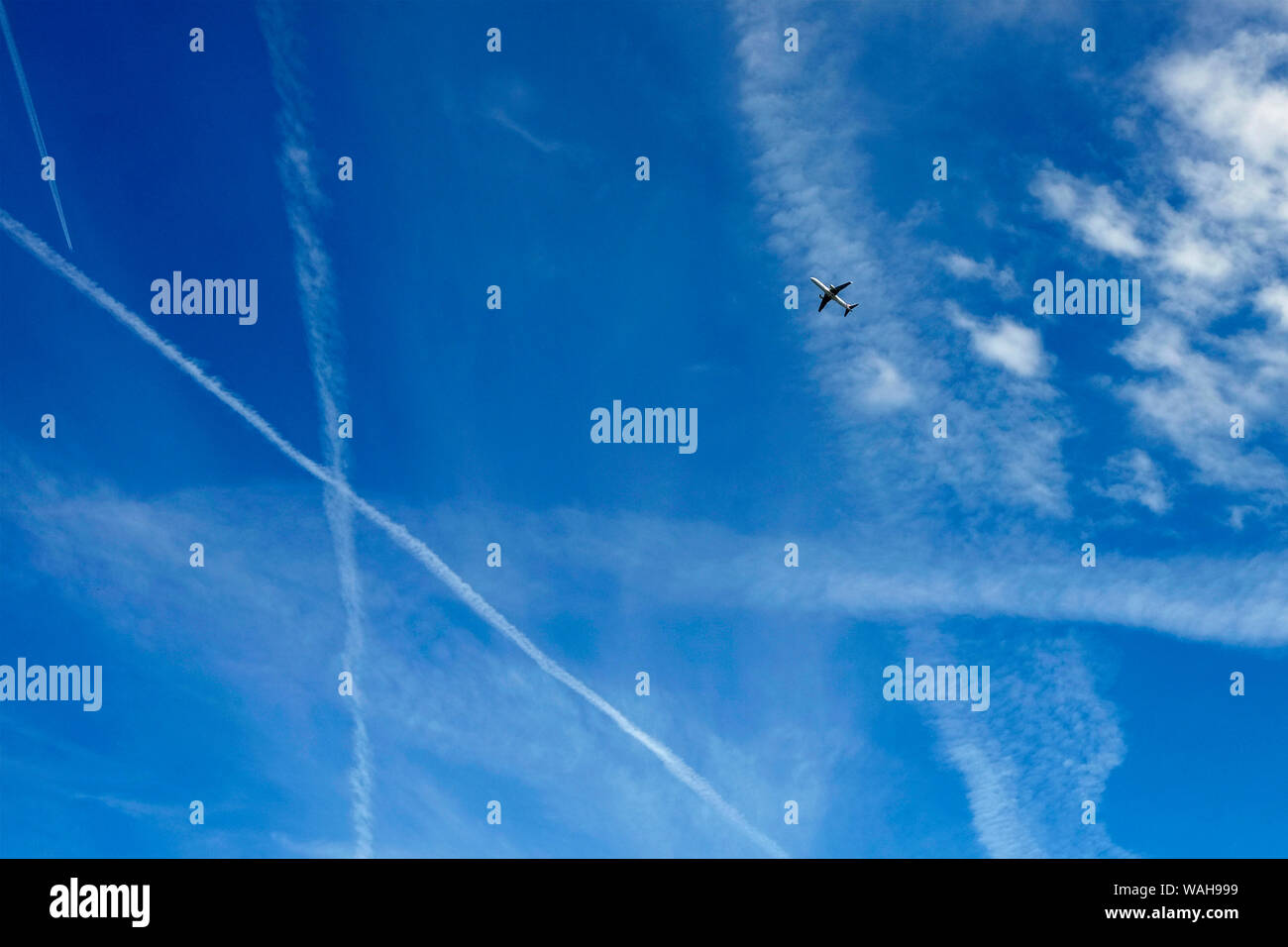 Blue sky clouds contrails hi-res stock photography and images - Alamy