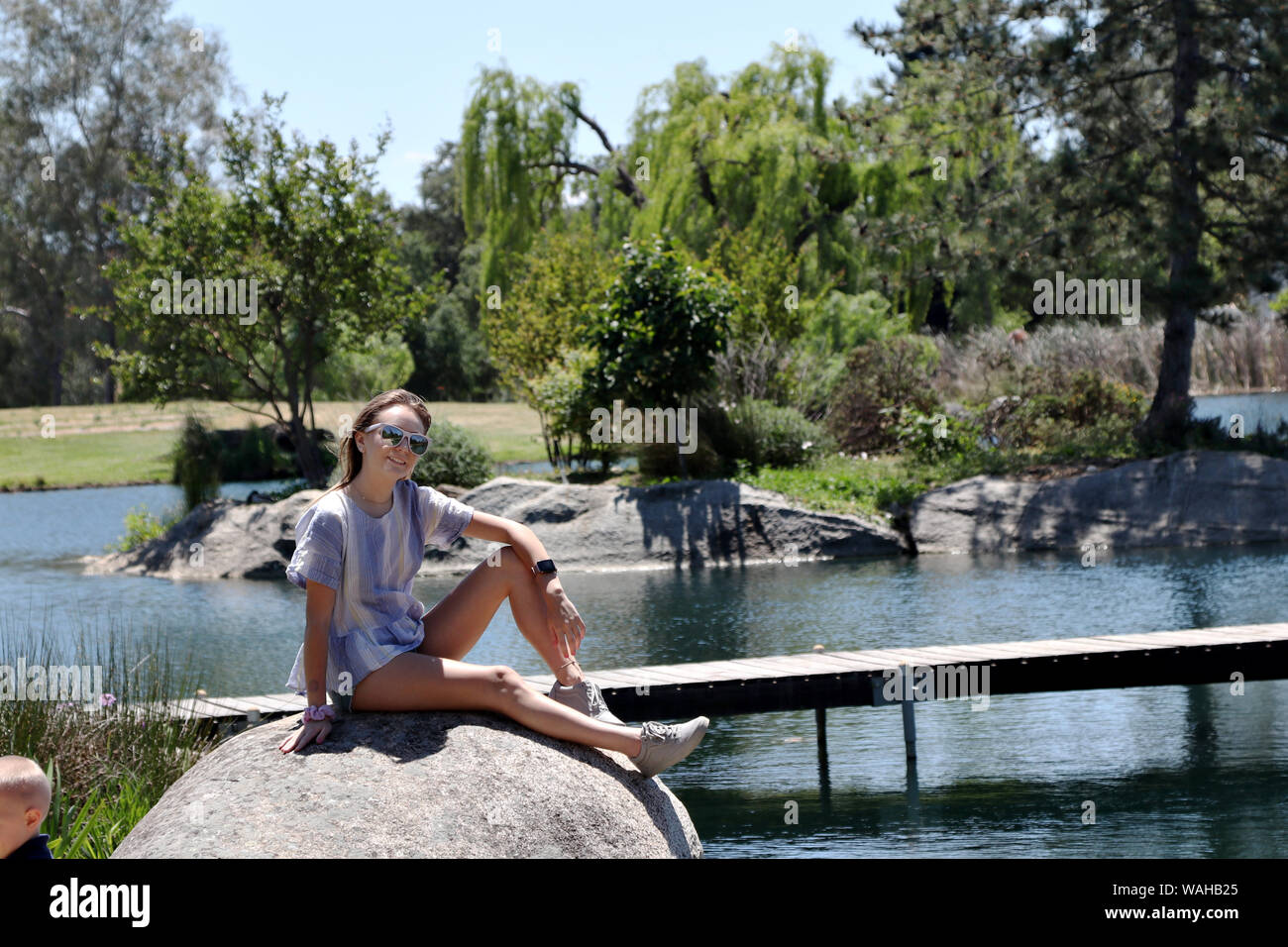 Kids having fun and playing in a rural pond Stock Photo - Alamy