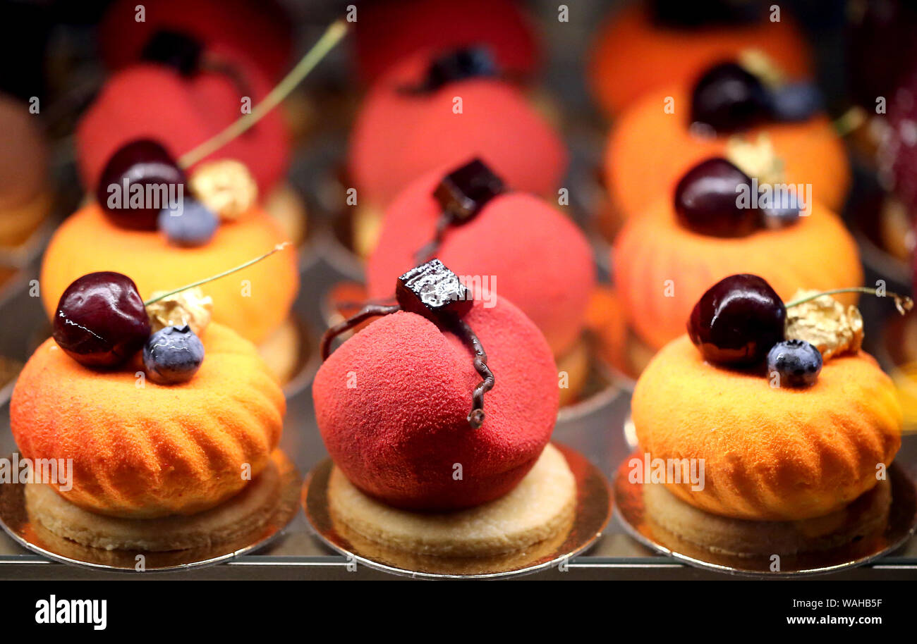 Delicious multi-colored cakes with cherries photographed close-up Stock ...