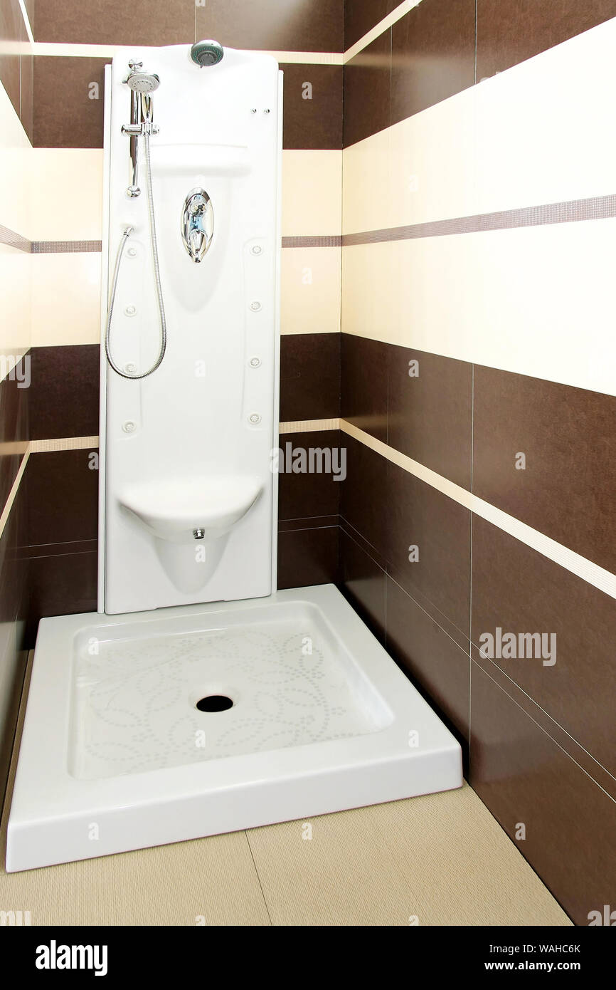 Angle shot of shower with brown tiles Stock Photo - Alamy