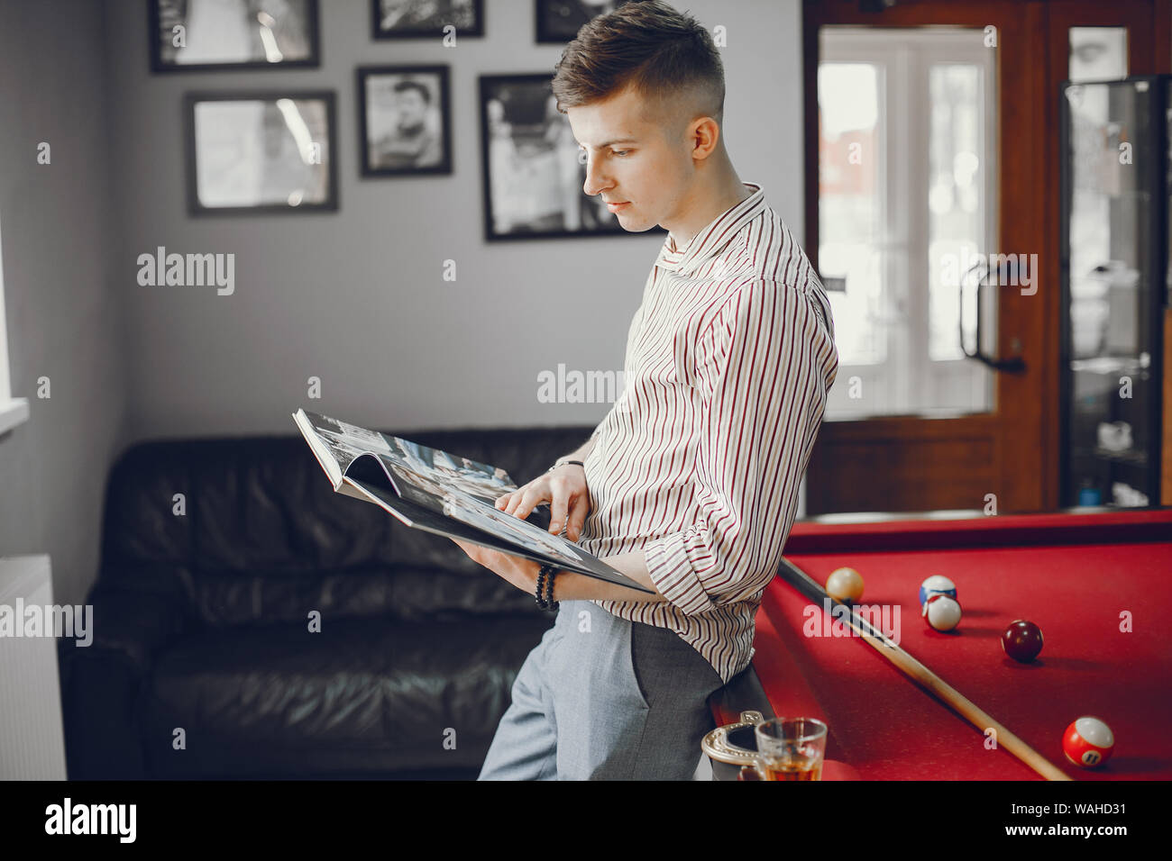 A nice guy playing a billiard Stock Photo - Alamy