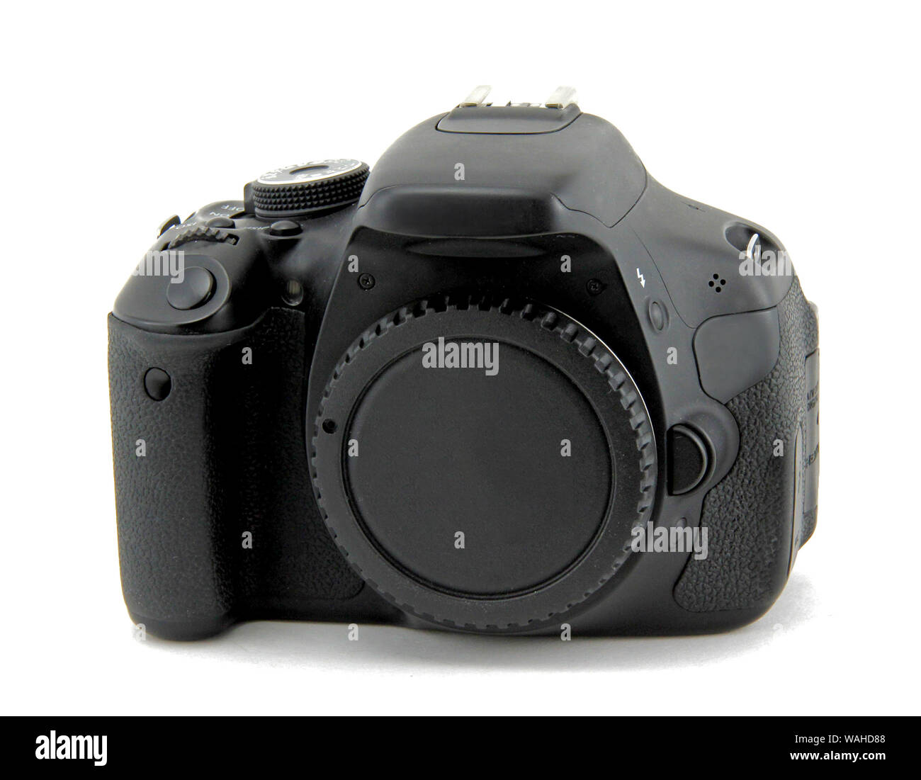 Camera on white background without lens. There is a black cap instead ...
