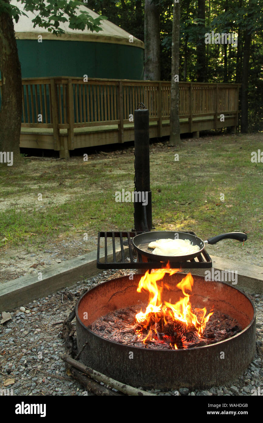 Food cooked over an open fire while camping Stock Photo - Alamy