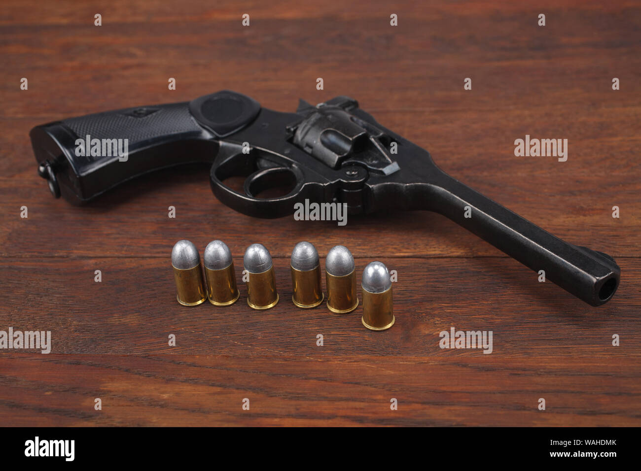WW2 period British Army Revolver with ammunitions on wooden table Stock ...