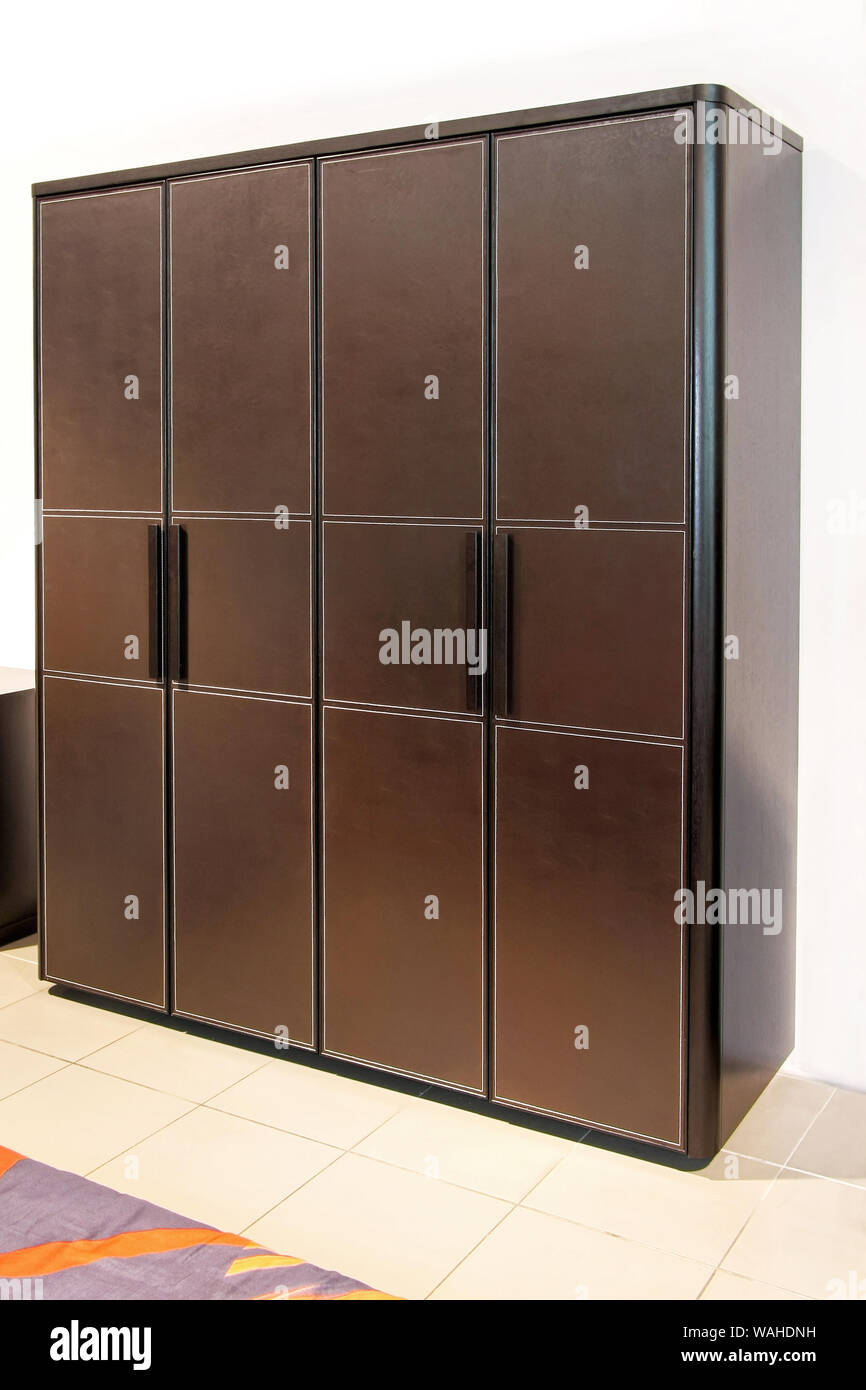 Interior of bedroom with big silver locker Stock Photo - Alamy
