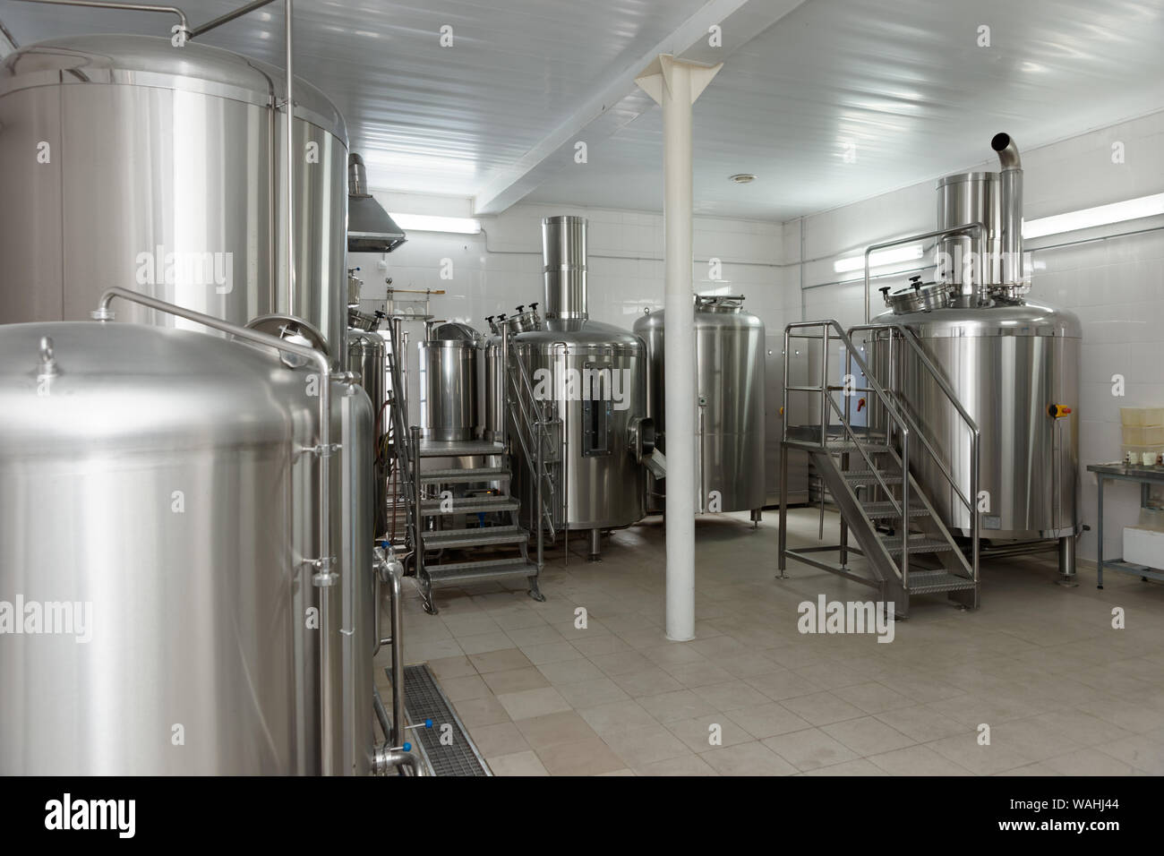 Beer-making tanks in small capacity brewery Stock Photo - Alamy