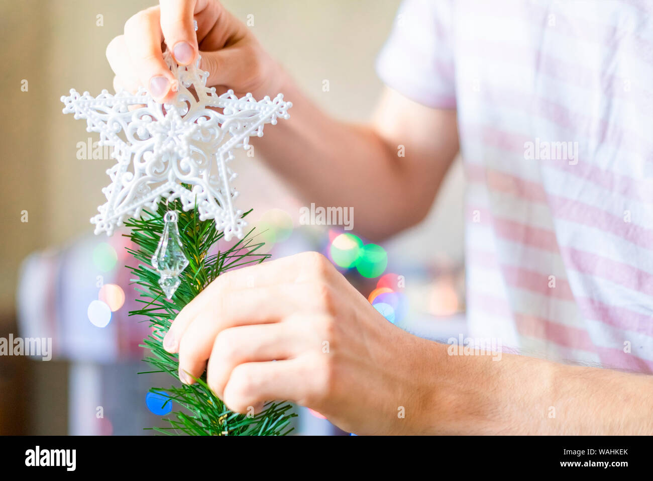 Putting star on christmas tree hi-res stock photography and images - Alamy
