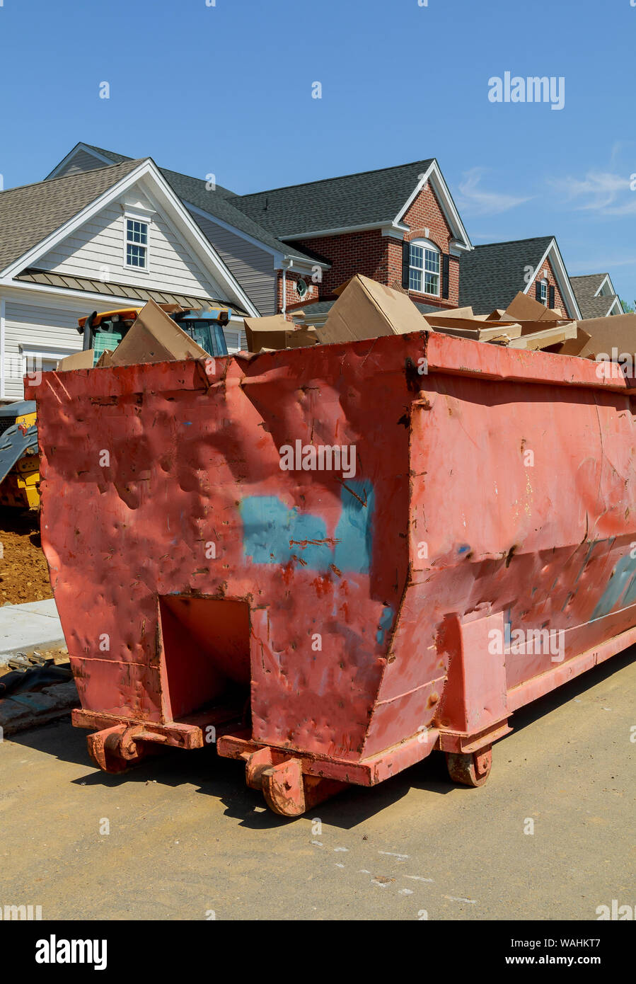 Old and used construction material in the new building frame of a new ...