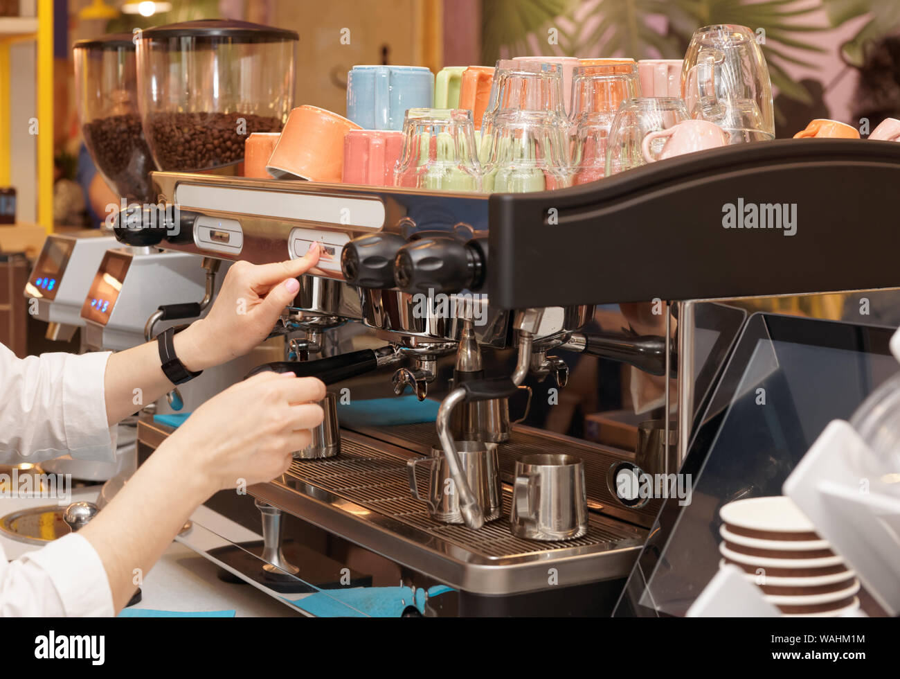Barista is brewing coffee using professional espresso machine Stock ...