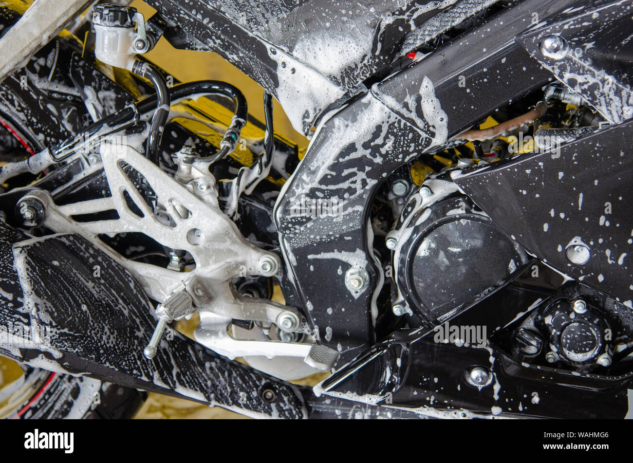 Bubble foam cleaning motorcycle wash Stock Photo - Alamy