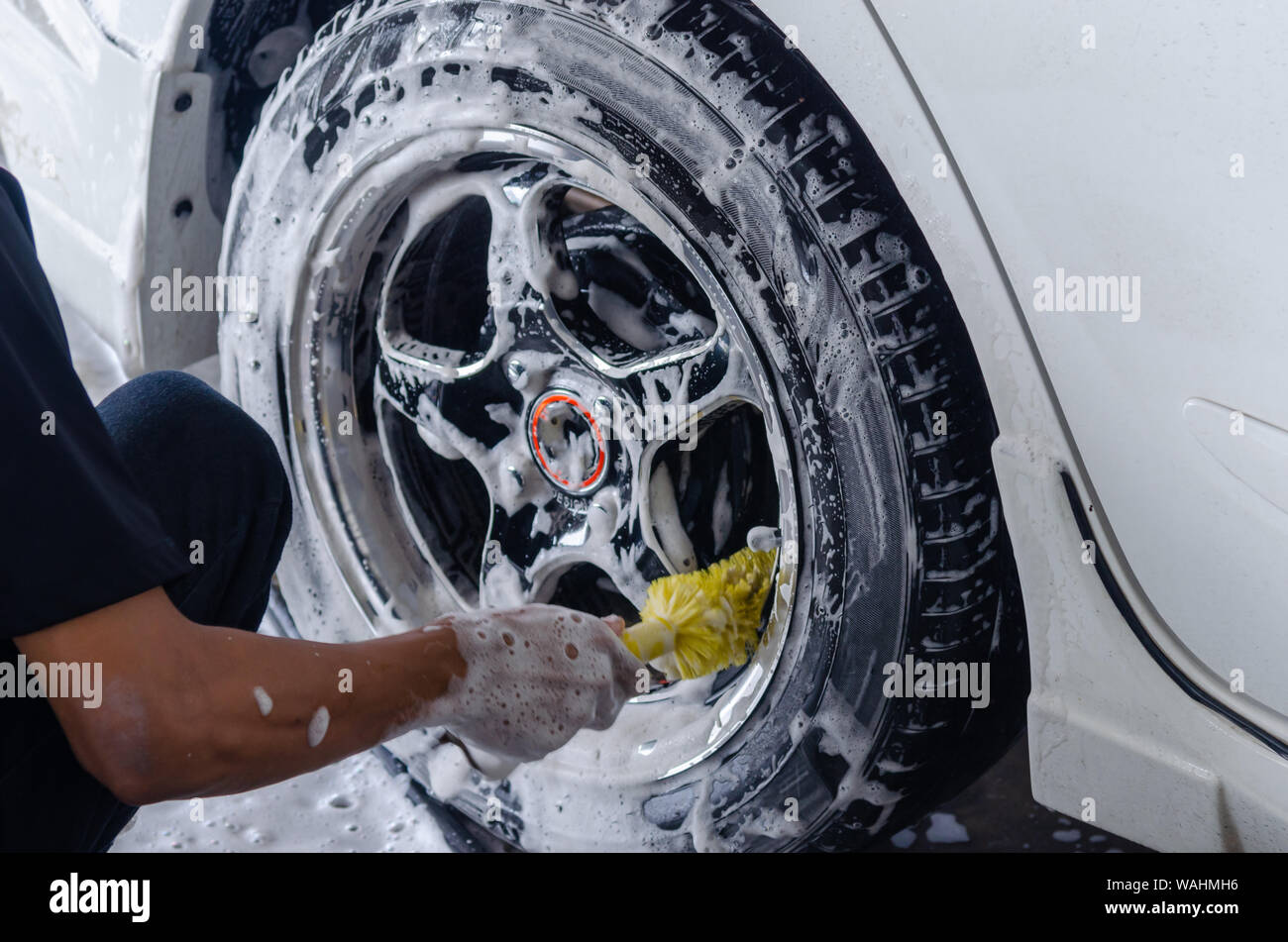 Car wash, cleaning the wheels Stock Photo - Alamy