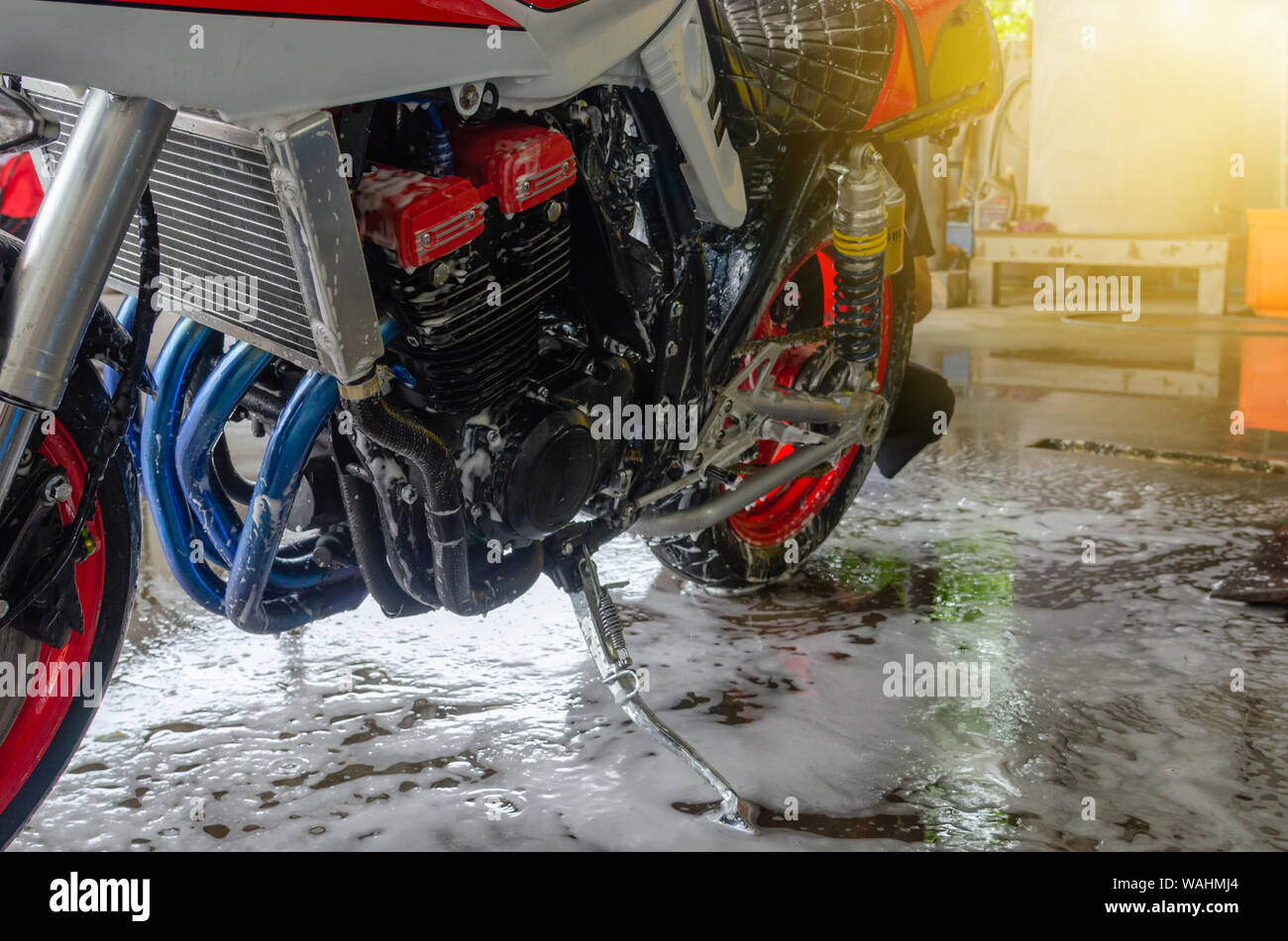 Bubble foam cleaning motorcycle wash Stock Photo - Alamy