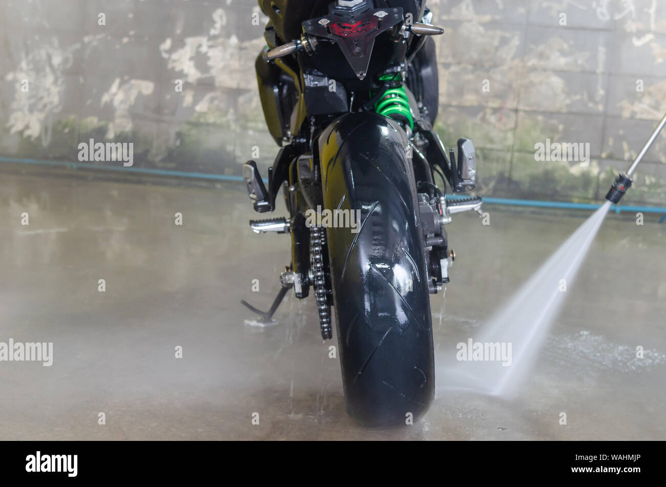 Bubble foam cleaning motorcycle wash Stock Photo - Alamy