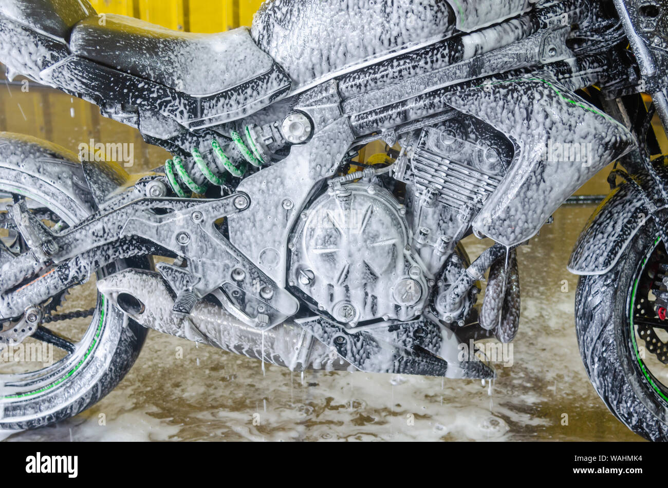 Bubble foam cleaning motorcycle wash Stock Photo - Alamy