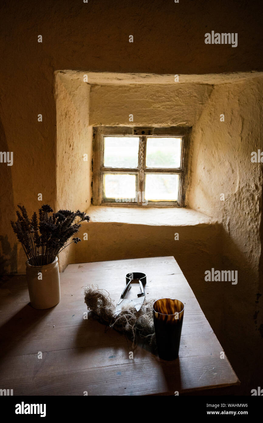Still life objects of dried lavender on a table in window light ...