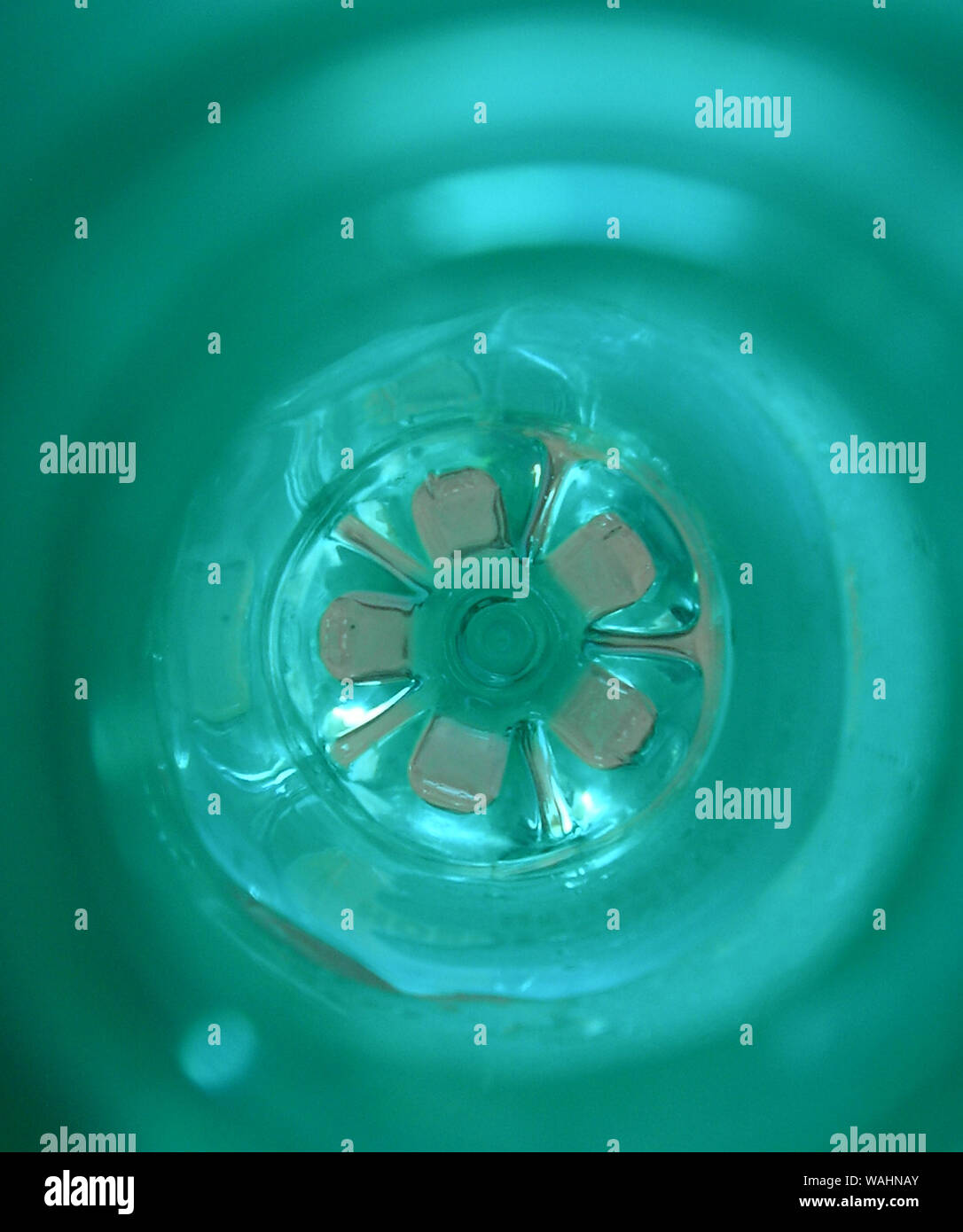 Bottom of a glass bottle on a white background Stock Photo - Alamy