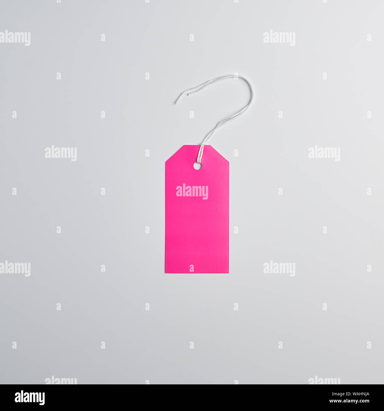 rectangle paper pink tags for things on a white rope, white background ...