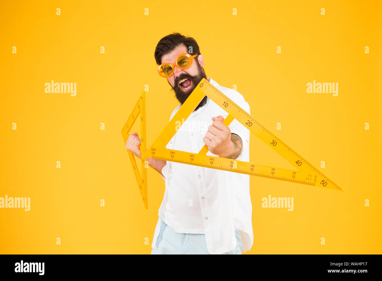 Smart student. Geometry teacher. Student using measuring instrument ...