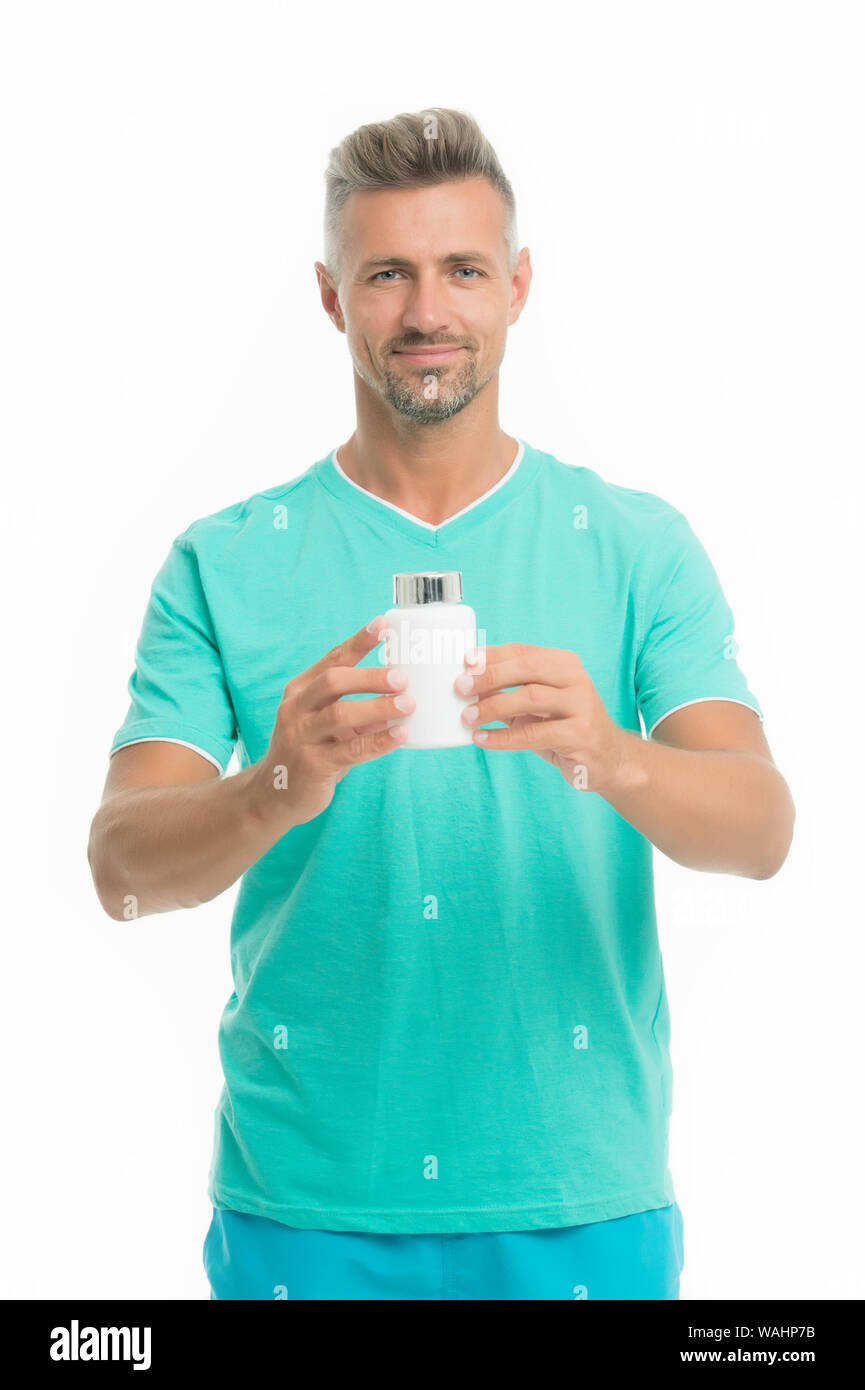 Medicines concept. Health is wealth. Bearded man holding vitamin pill ...