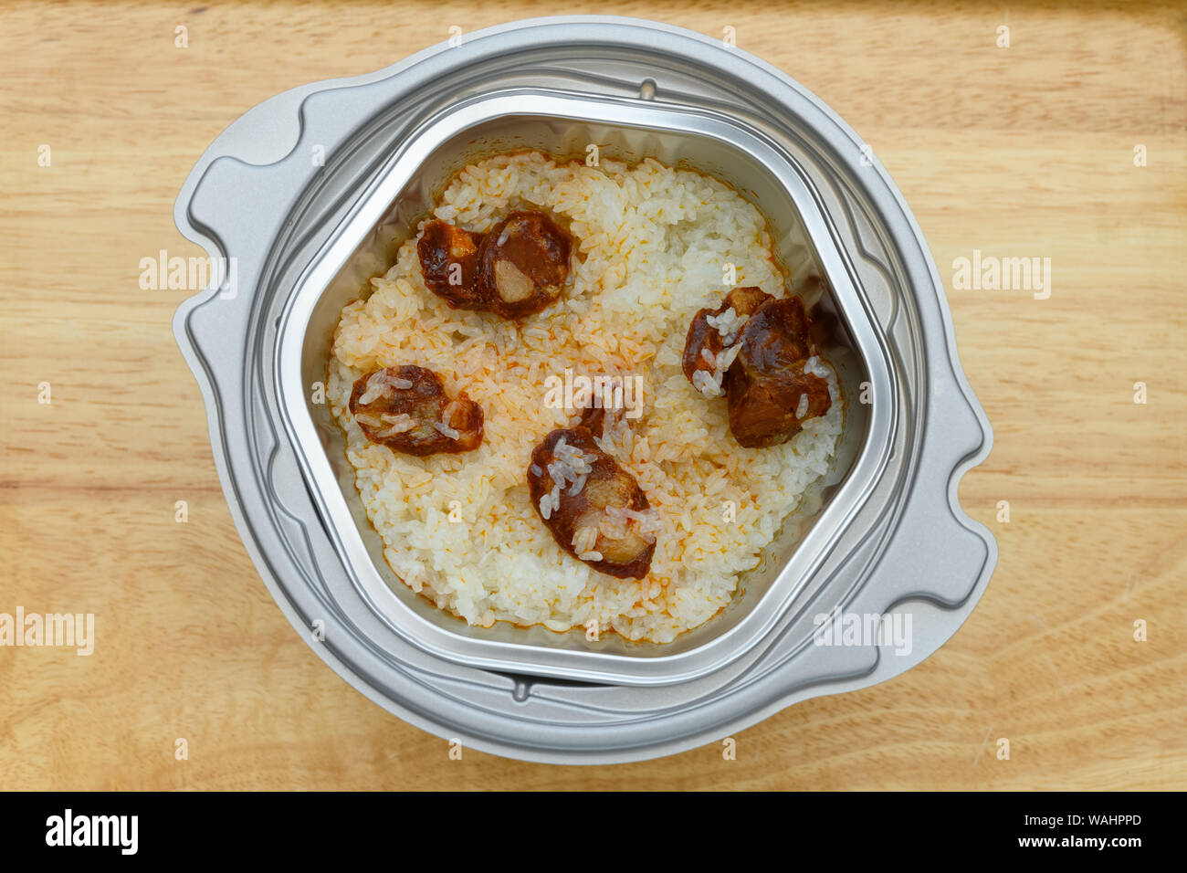top view raw self cooking fast food of rice with sausage slices Stock ...