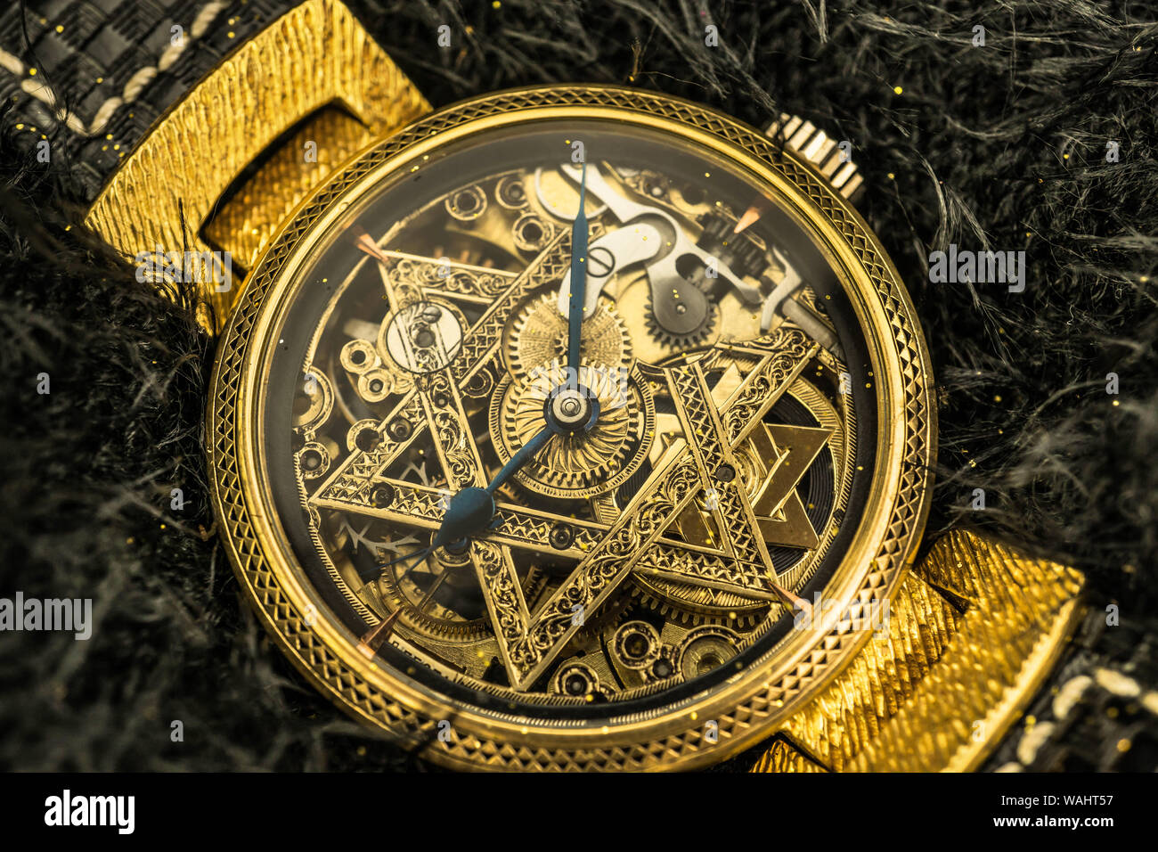 Vintage skeleton watch with Star of David on black fur background Stock ...