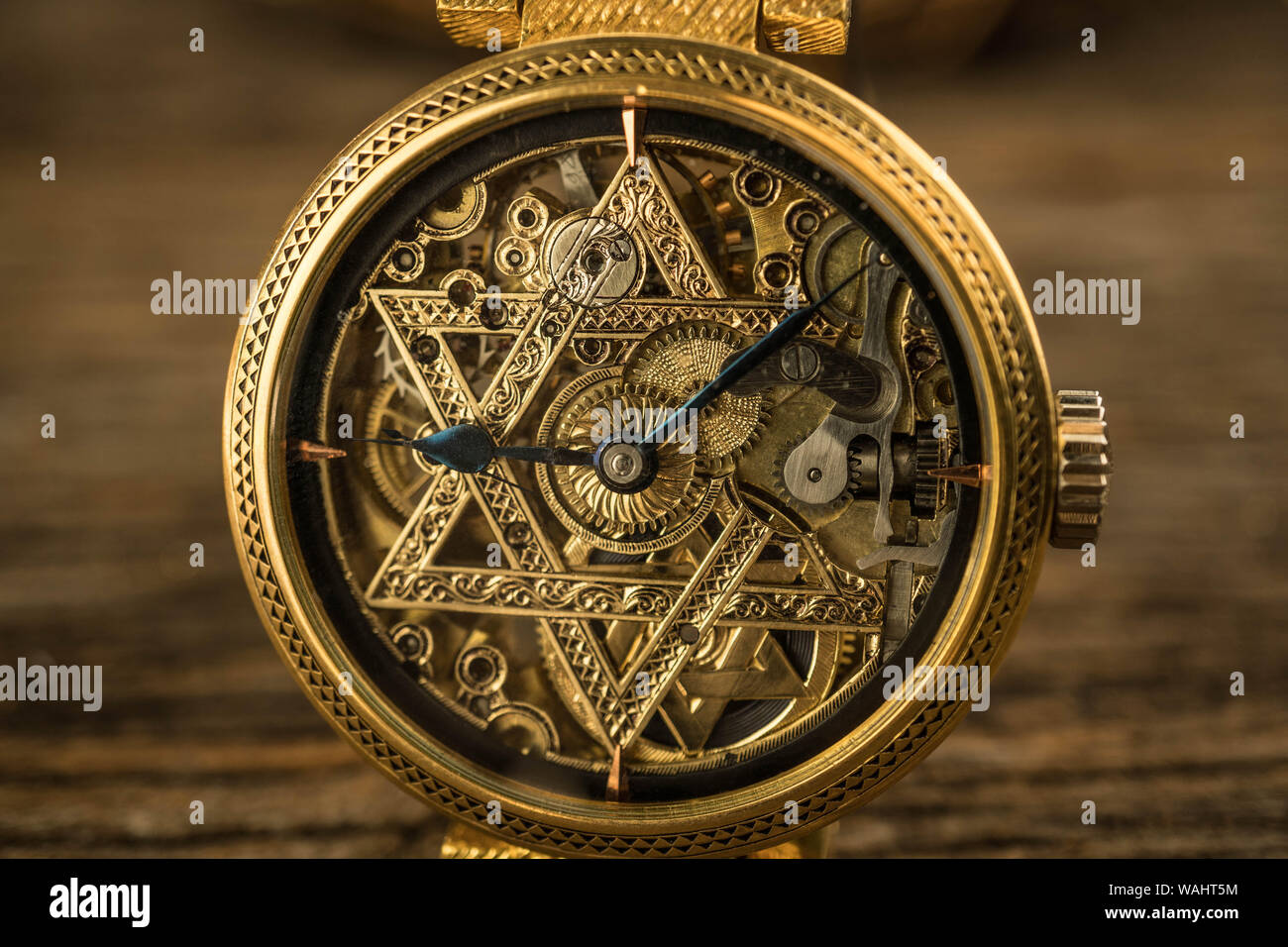 Vintage skeleton watch with Star of David on wood background Stock ...