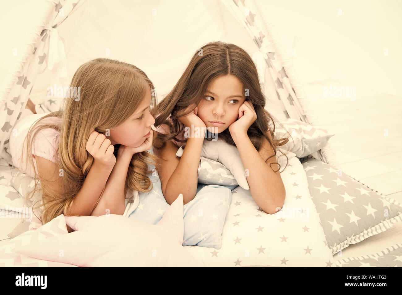 Pajamas party for kids. Cozy place tipi house. Sisters or best friends ...