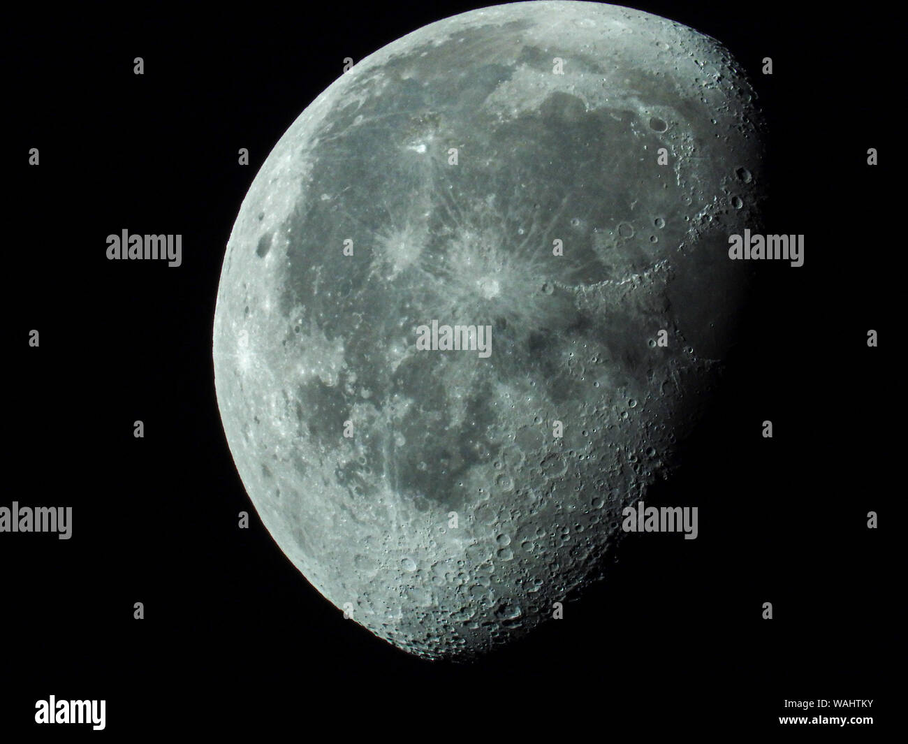 a very dense close-up of a decreasing moon in the night sky Stock Photo ...