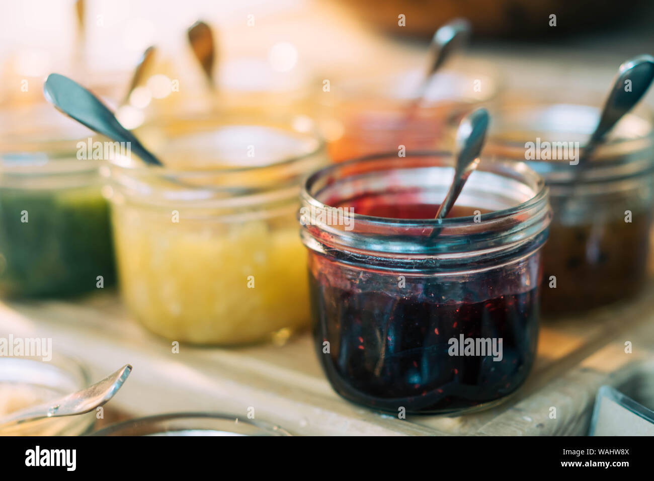 Homemade jars of variety fruits jam on the table Stock Photo - Alamy