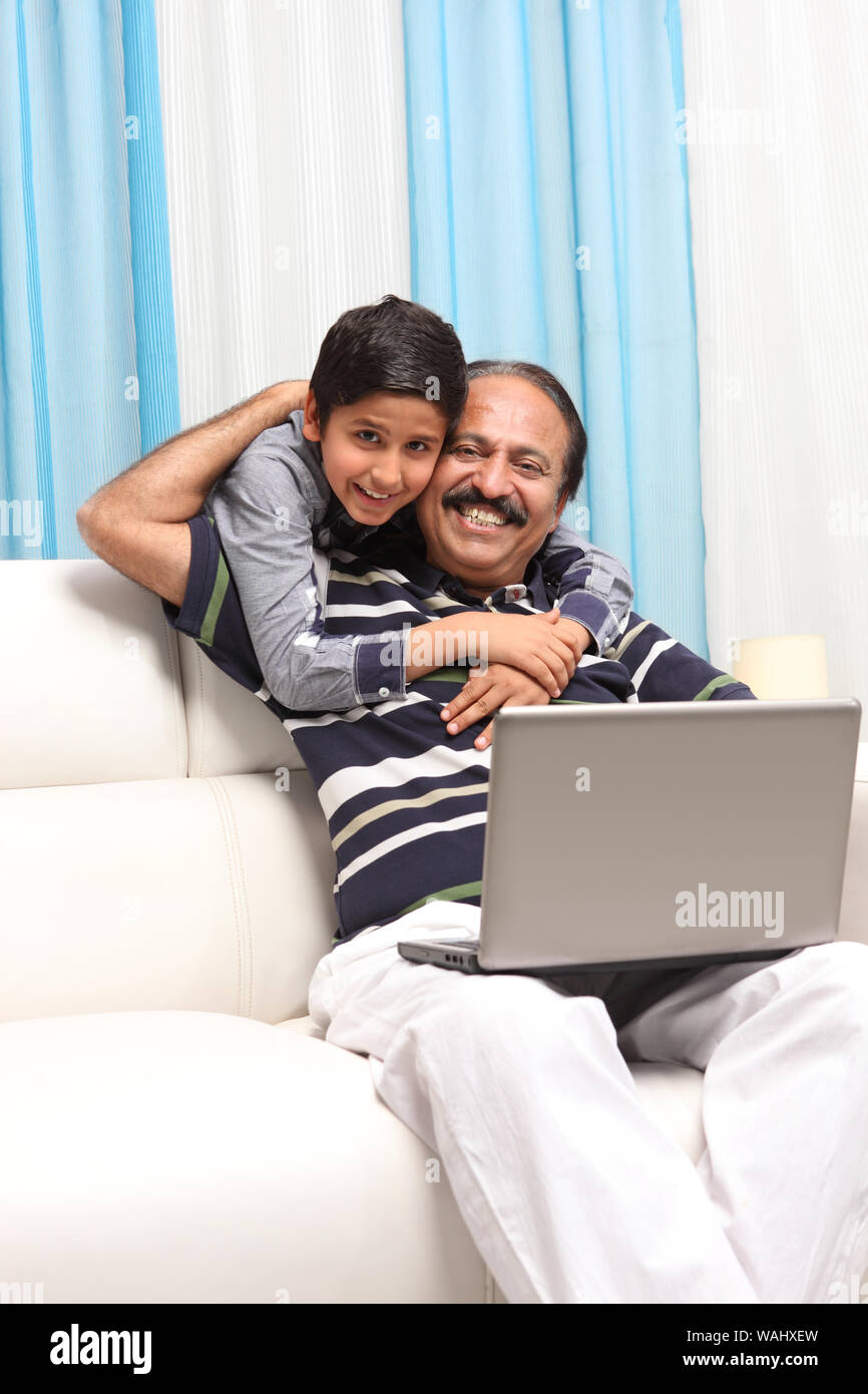 Boy hugging laptop hi-res stock photography and images - Alamy