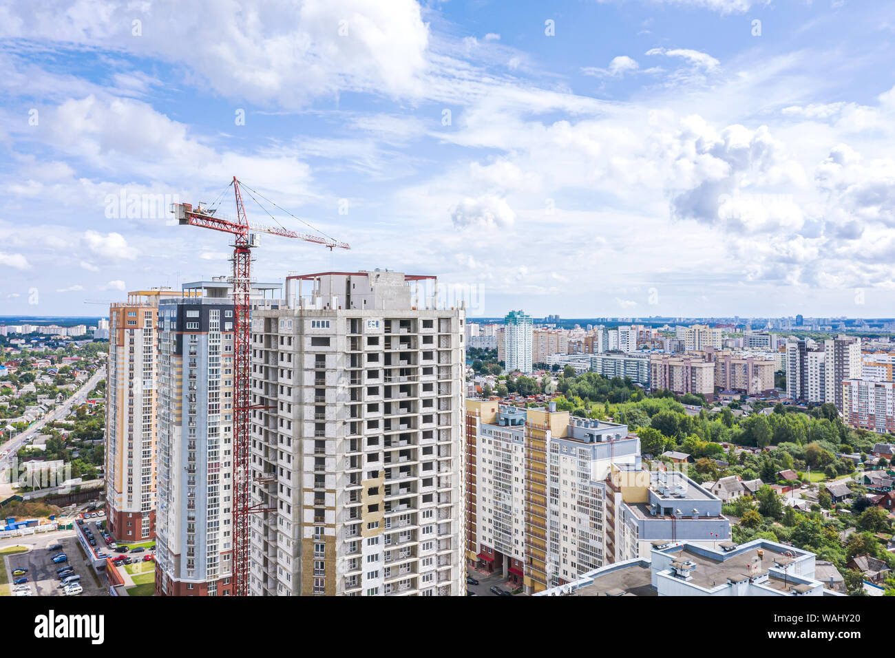 aerial top view of city construction site with new buildings and tower ...