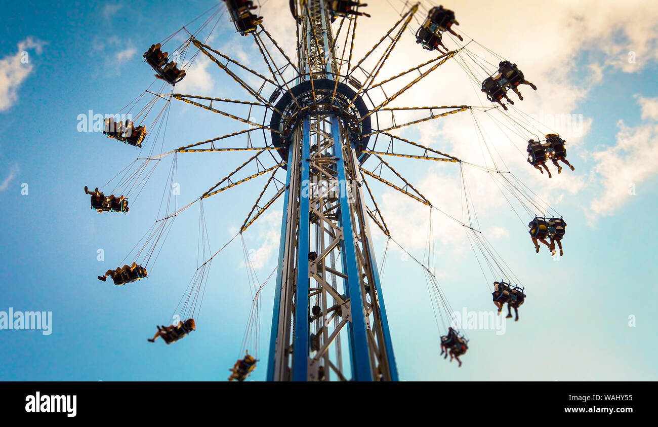 Spinning swings amusement park hi-res stock photography and images - Alamy