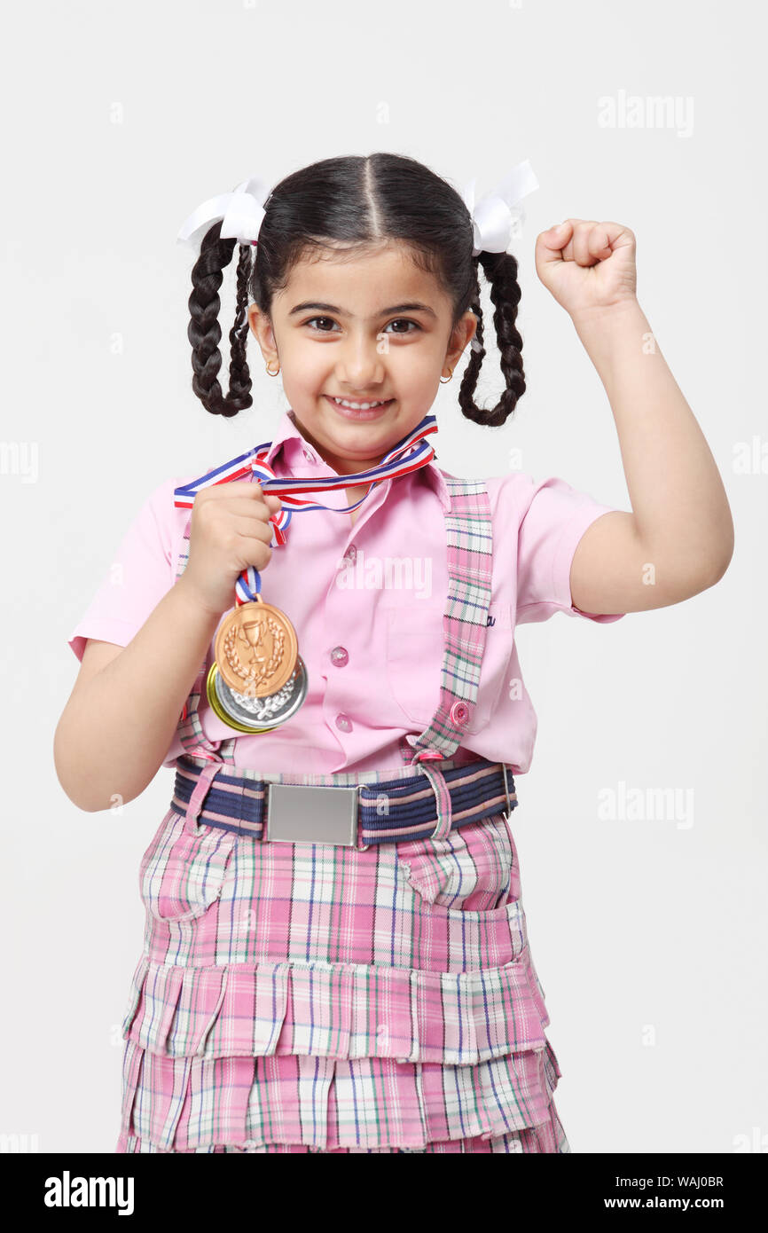 Schoolgirl showing medals Stock Photo - Alamy