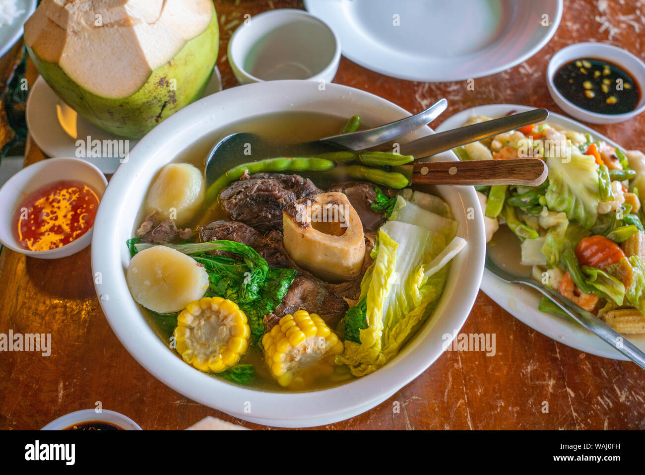 Philippines traditional dinner with bulalo beef marrow bones and ...