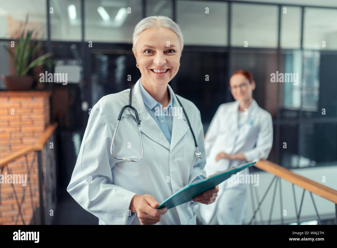 Good-looking Caucasian senior female doctor with a stethoscope Stock ...